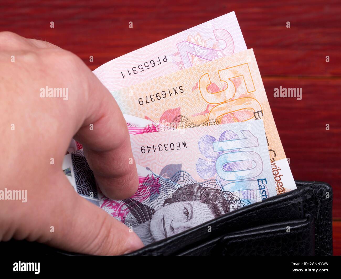 Eastern Caribbean money - dollar in the black wallet Stock Photo - Alamy