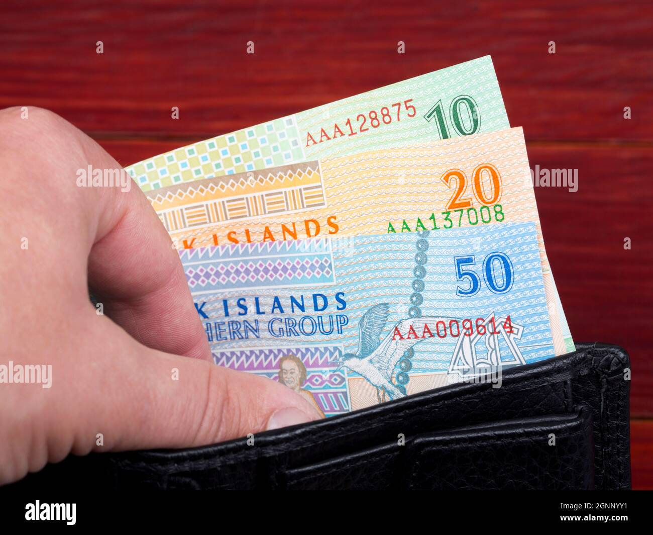 Cook Islands dollar in the black wallet Stock Photo - Alamy
