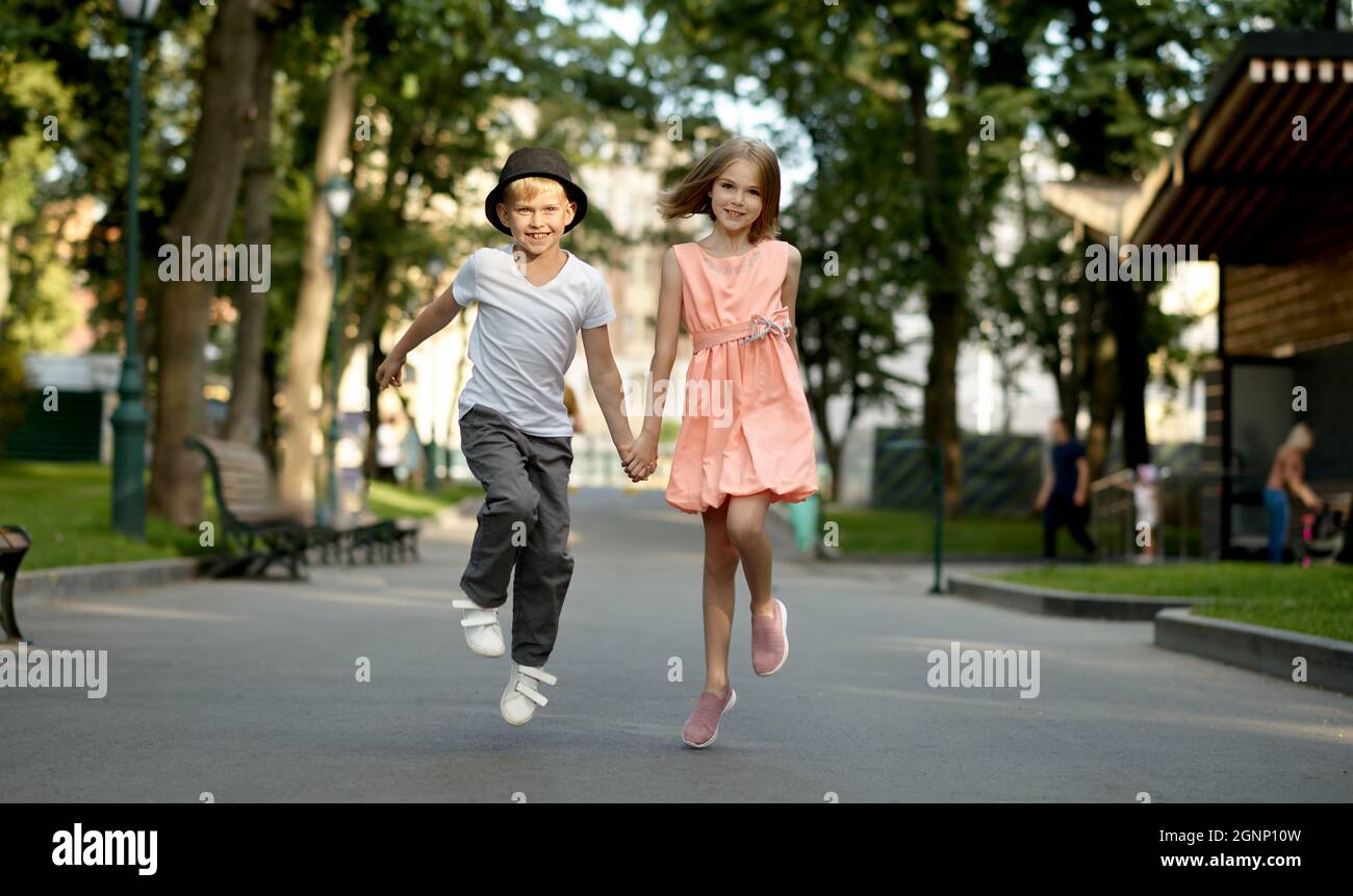 Children's romantic date in summer park Stock Photo - Alamy