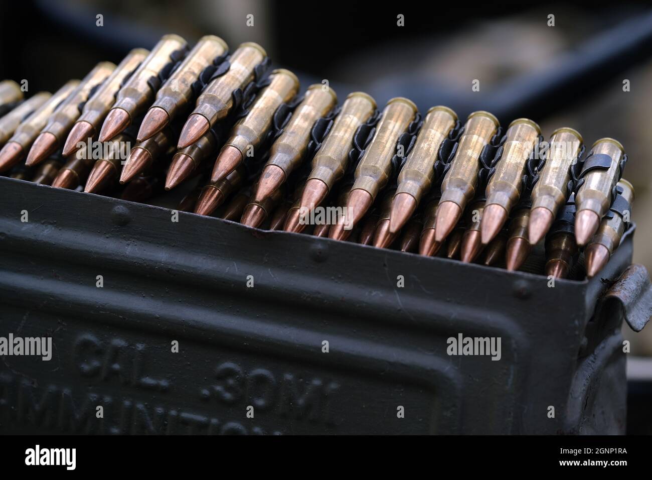 Belt of machine gun ammunition ready to feed to weapon Stock Photo - Alamy