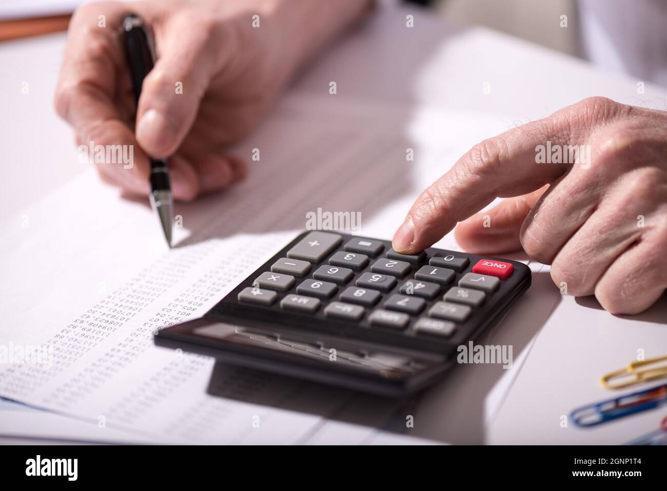 Male hand using calculator, accounting concept Stock Photo - Alamy