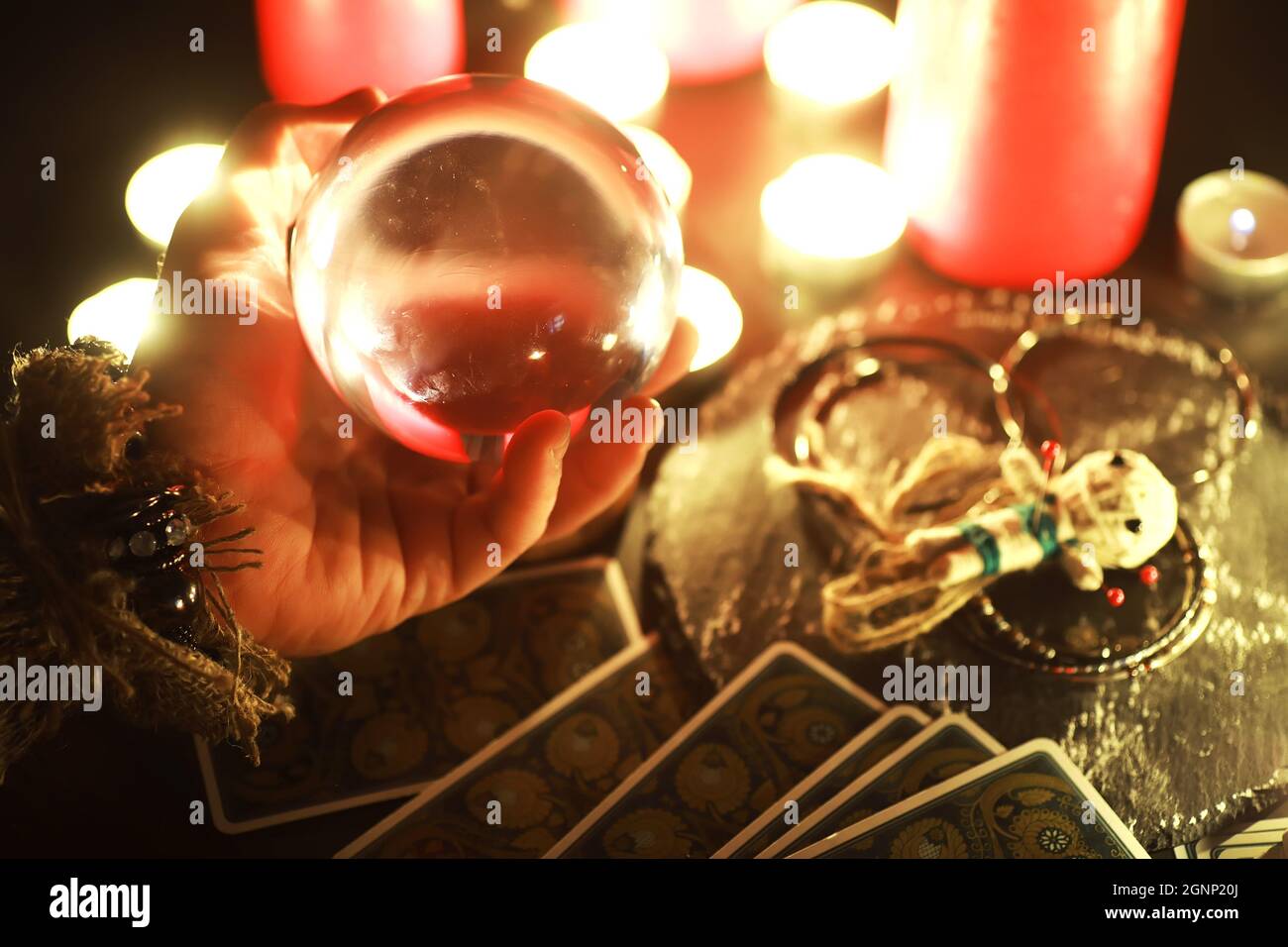Mystic still life with voodoo doll, the tarot cards, books, evil ...