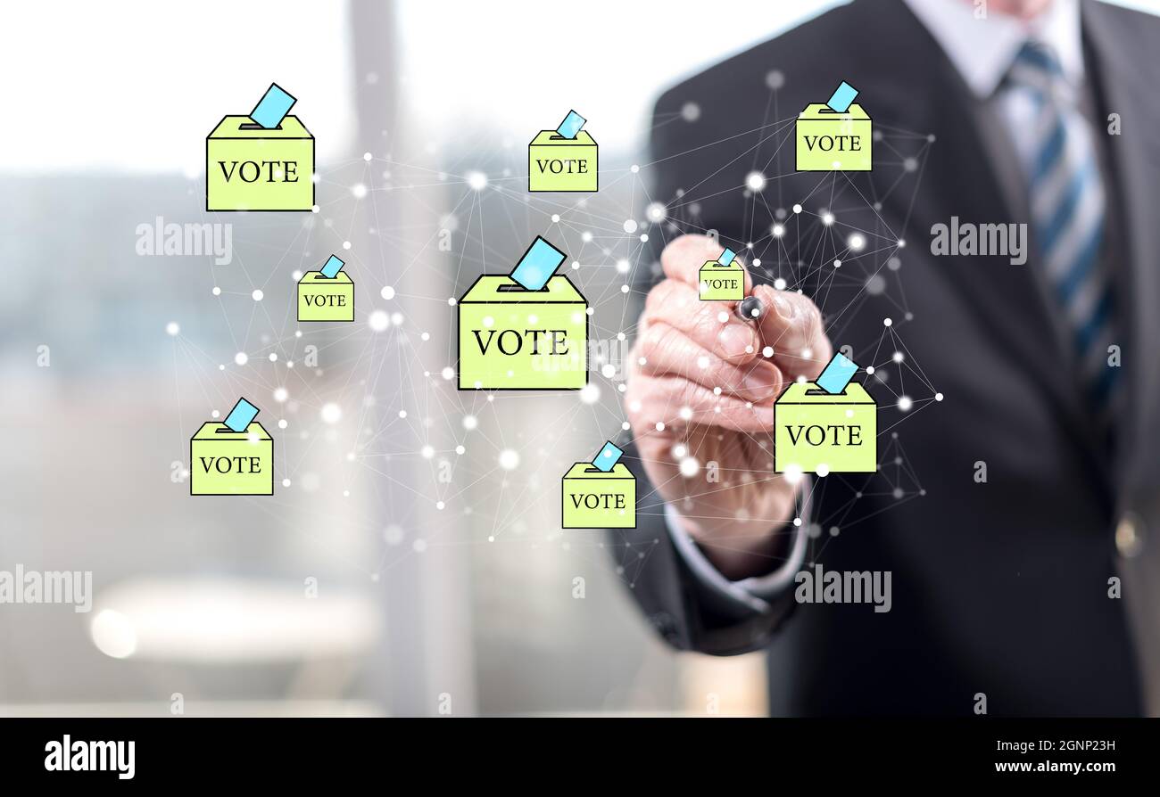 Man touching an online voting concept on a touch screen with a stylus ...