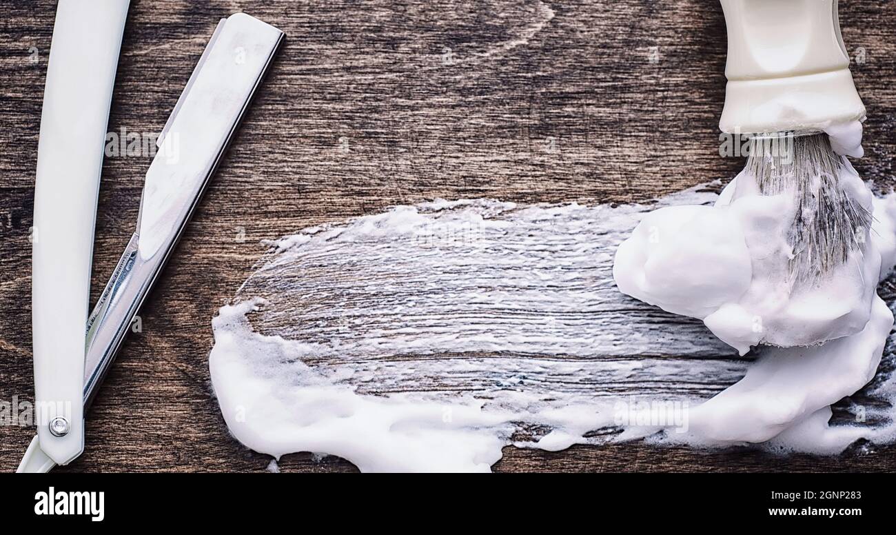 Shaving accessories on a wooden texture background. Tools. Disposable ...