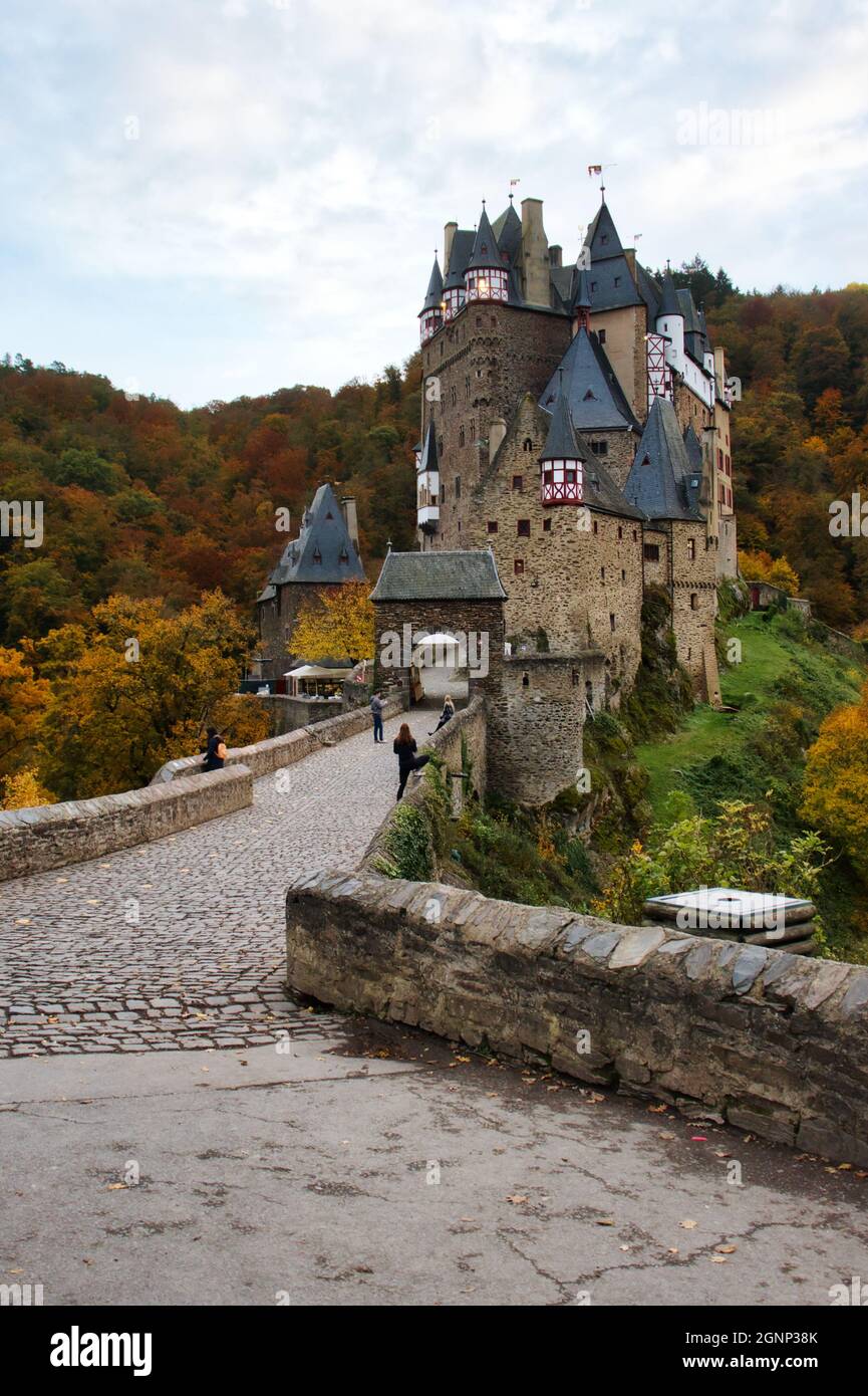 Bridge at the entrance of Eltz Castle on a warm fall evening in Germany ...