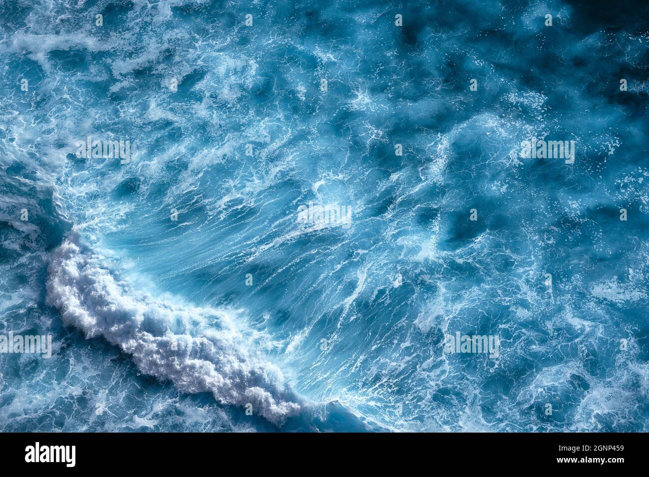 Aerial view to seething waves with foam. Waves of the sea meet each ...