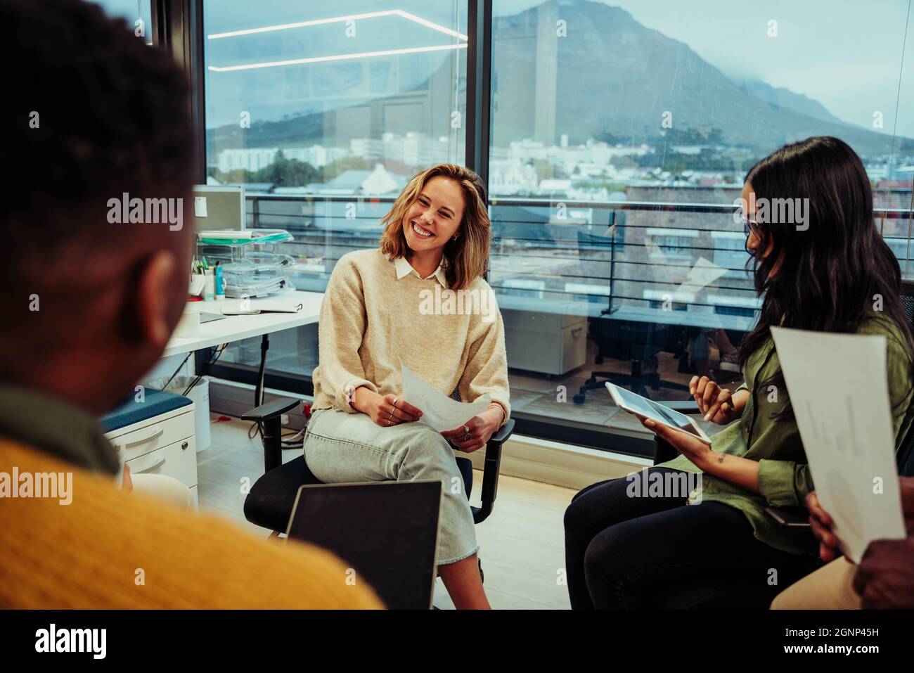 Beautiful smiling caucasian business woman laughing with colleagues in ...