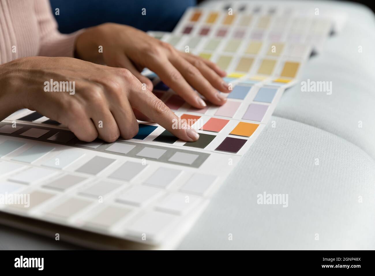 Close up of female choose color from palette Stock Photo - Alamy