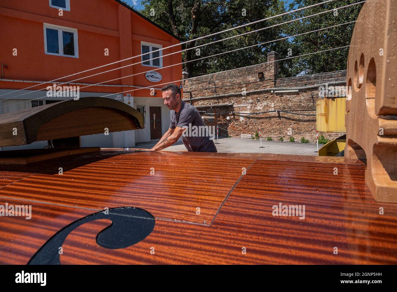 The launching of the violin-shaped boat Stock Photo - Alamy