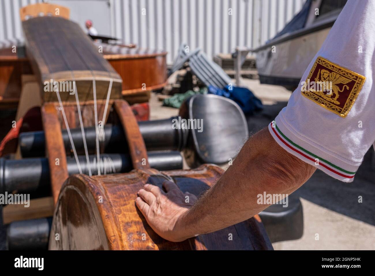 The launching of the violin-shaped boat Stock Photo - Alamy