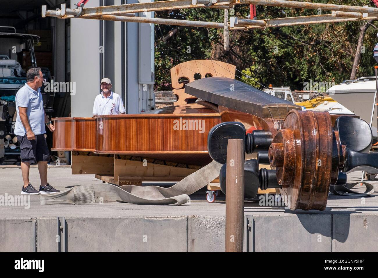 The launching of the violin-shaped boat Stock Photo - Alamy