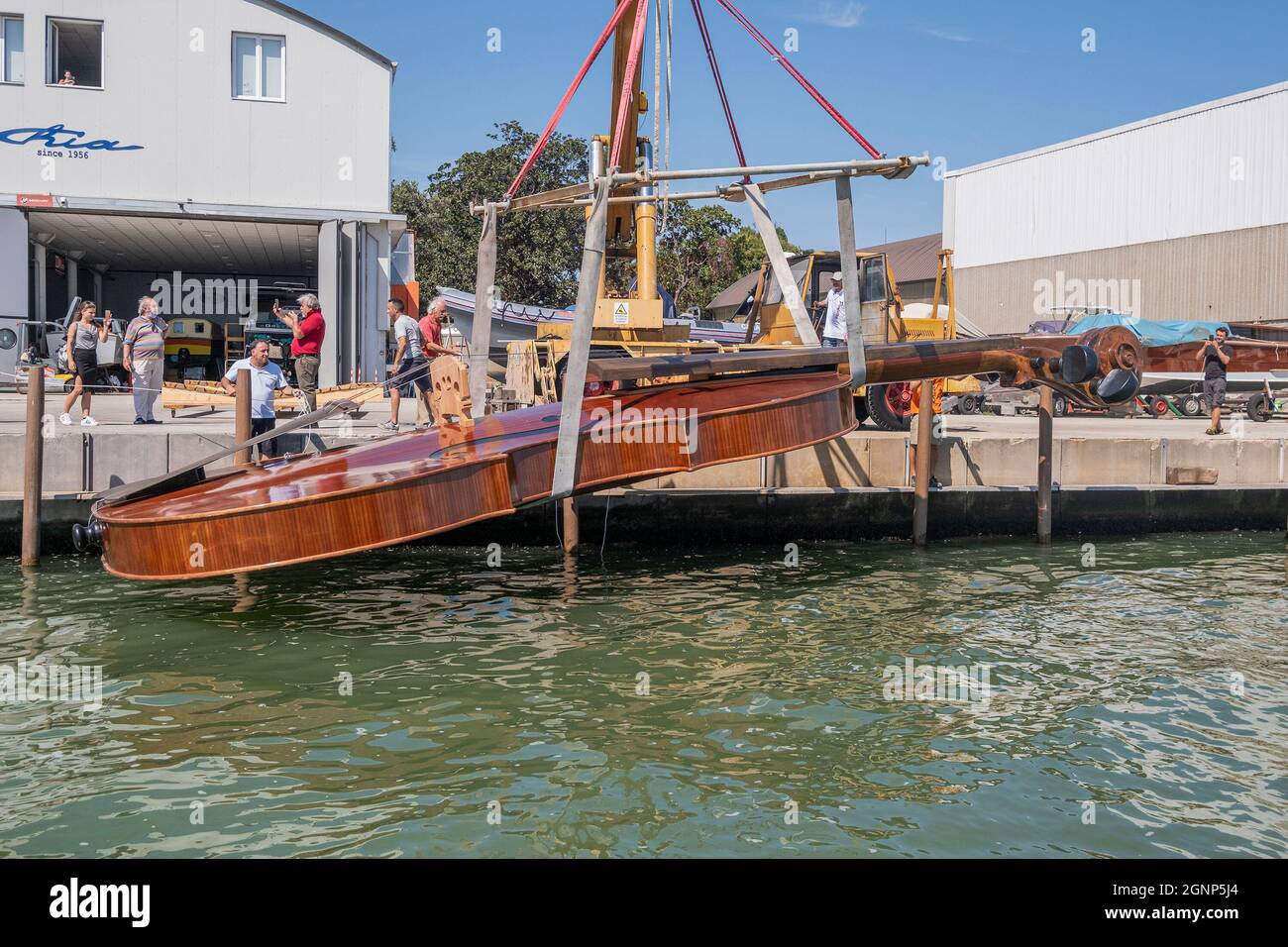 The launching of the violin-shaped boat Stock Photo - Alamy