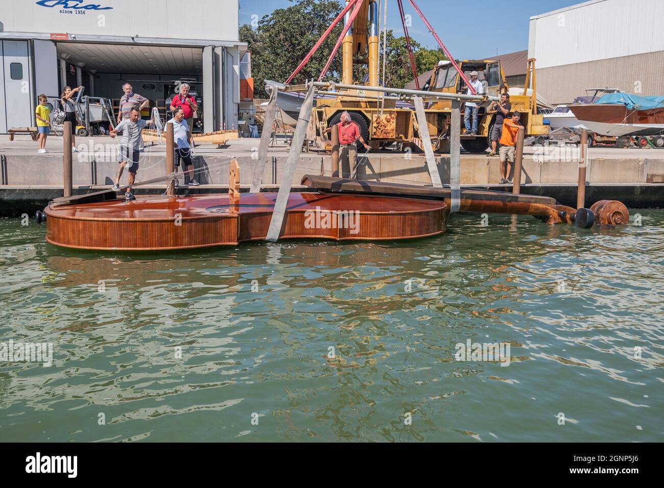 The launching of the violin-shaped boat Stock Photo - Alamy