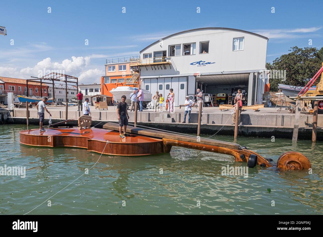 The launching of the violin-shaped boat Stock Photo - Alamy