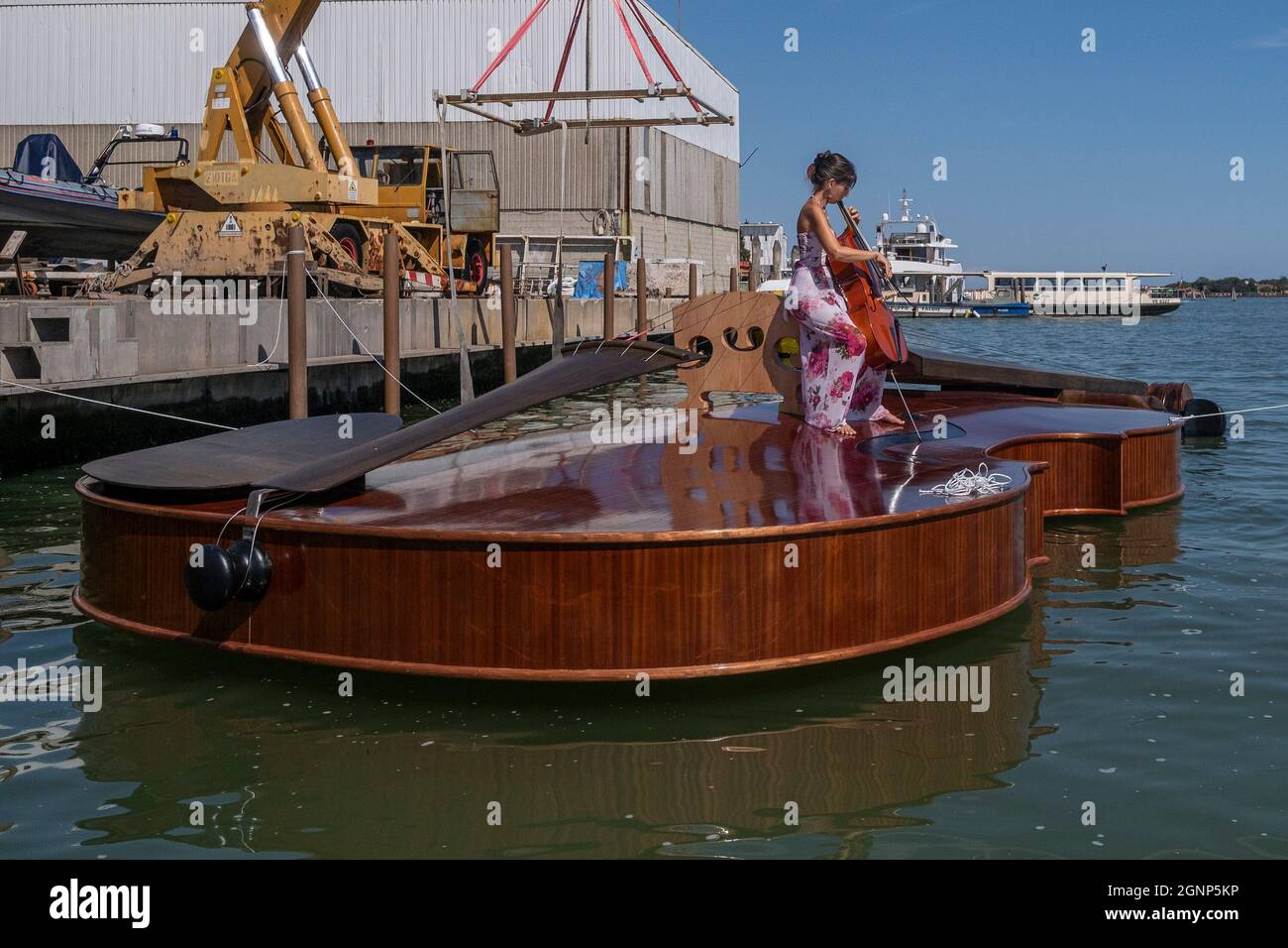 The launching of the violin-shaped boat Stock Photo - Alamy