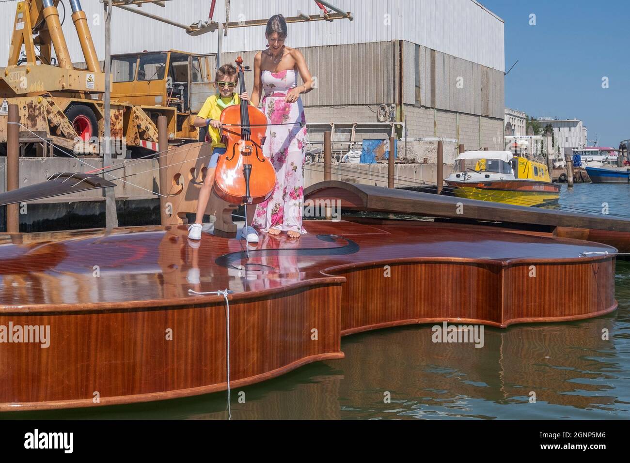 The launching of the violin-shaped boat Stock Photo - Alamy