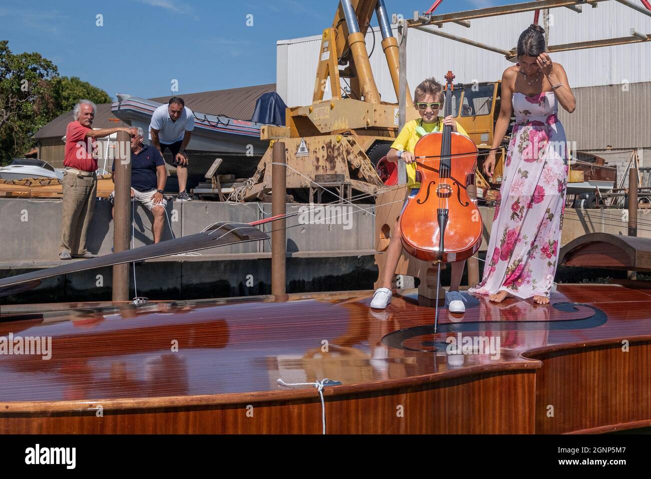 The launching of the violin-shaped boat Stock Photo - Alamy