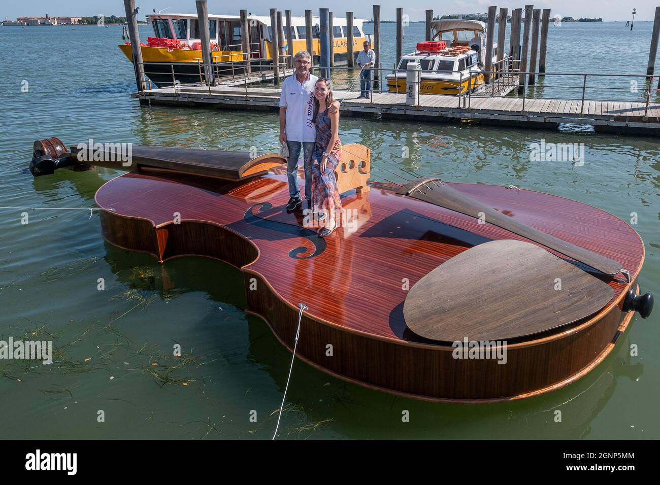 The launching of the violin-shaped boat Stock Photo - Alamy