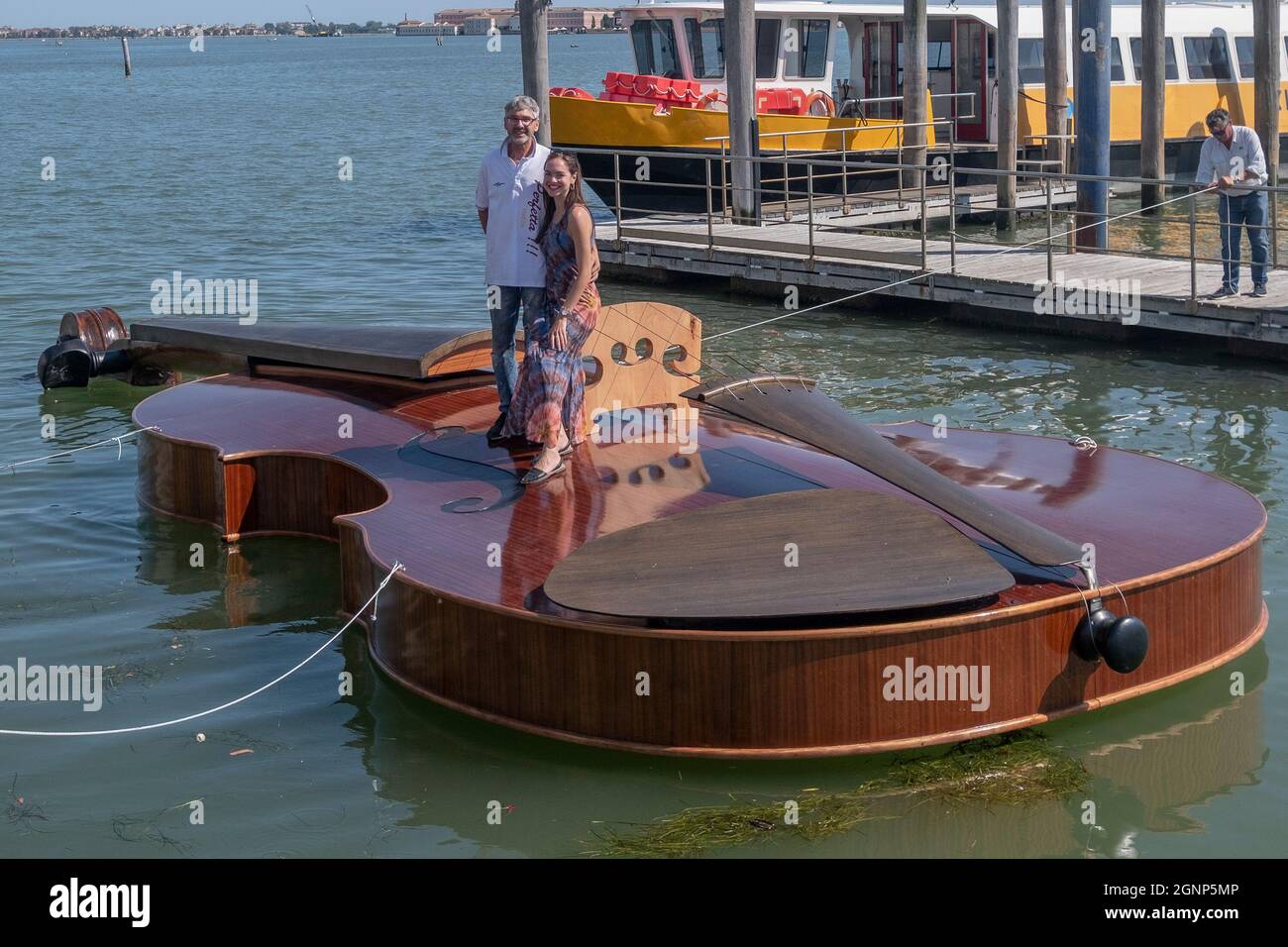 The launching of the violin-shaped boat Stock Photo - Alamy