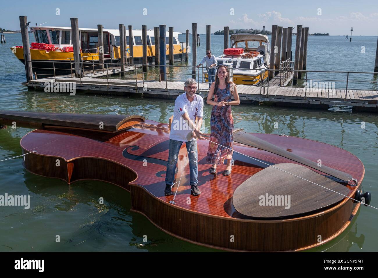 The launching of the violin-shaped boat Stock Photo - Alamy