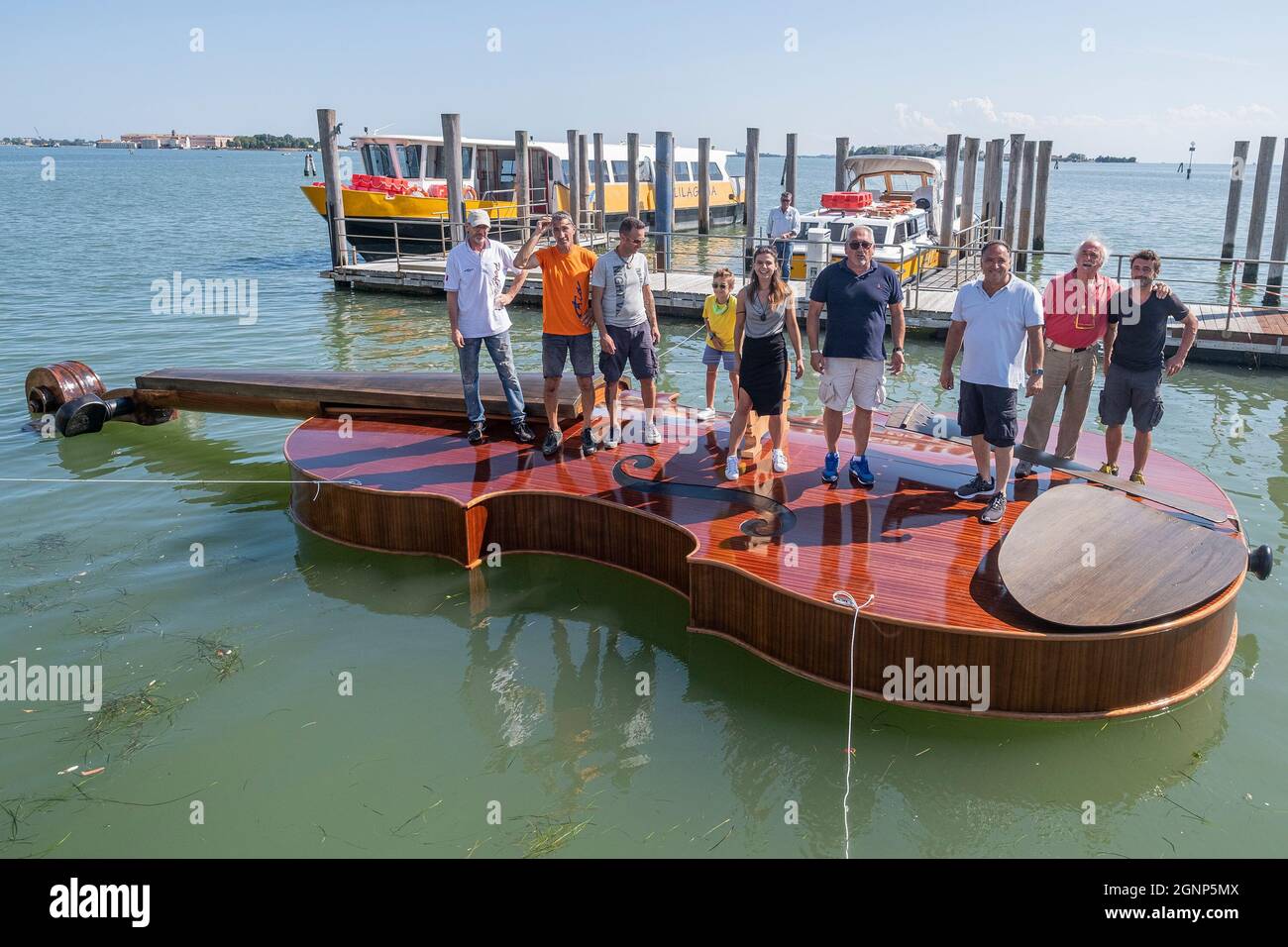 The launching of the violin-shaped boat Stock Photo - Alamy