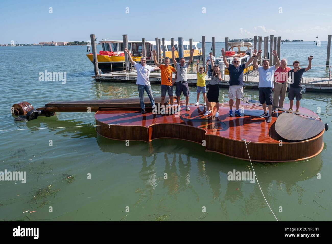 The launching of the violin-shaped boat Stock Photo - Alamy