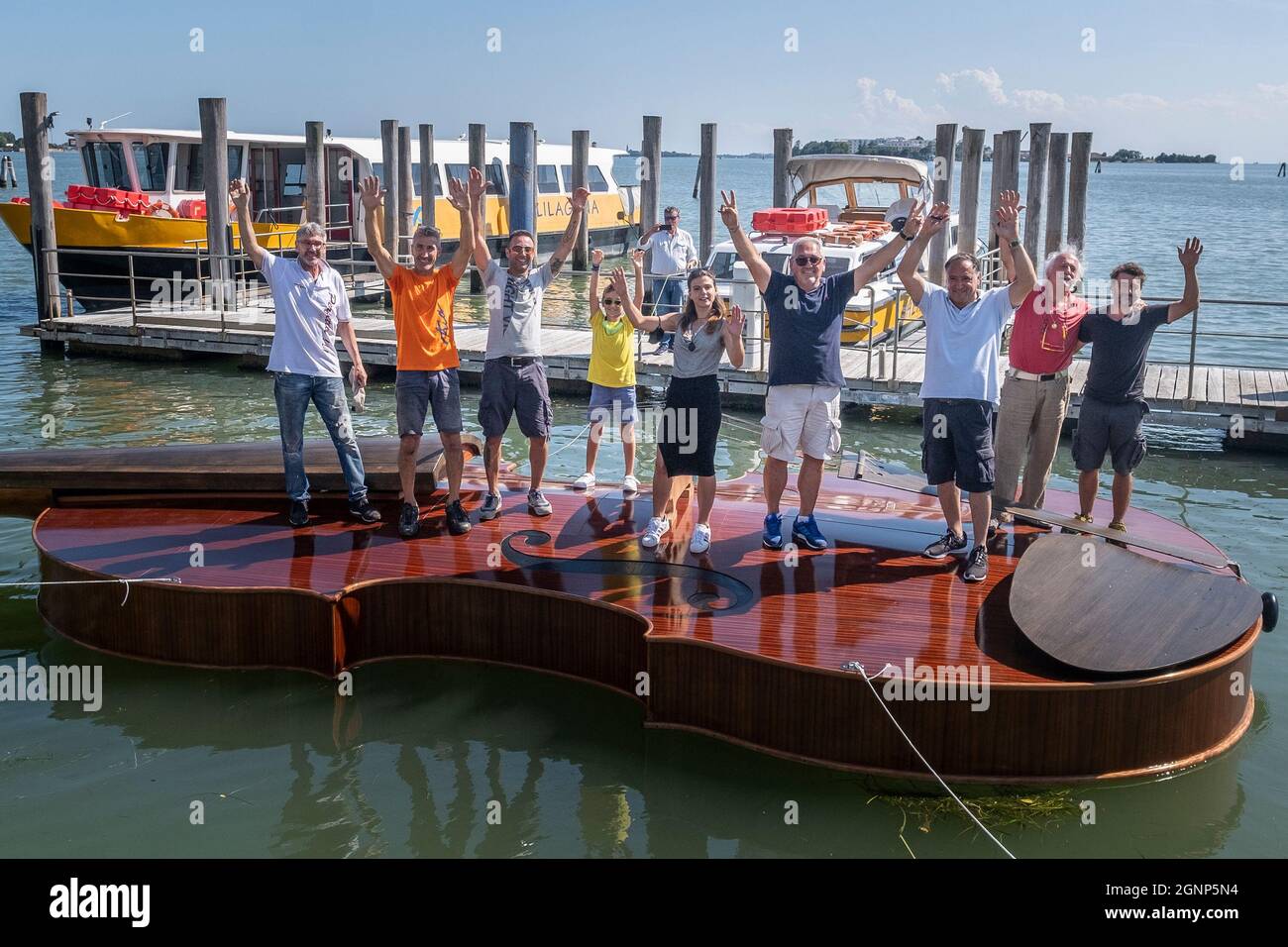 The launching of the violin-shaped boat Stock Photo - Alamy