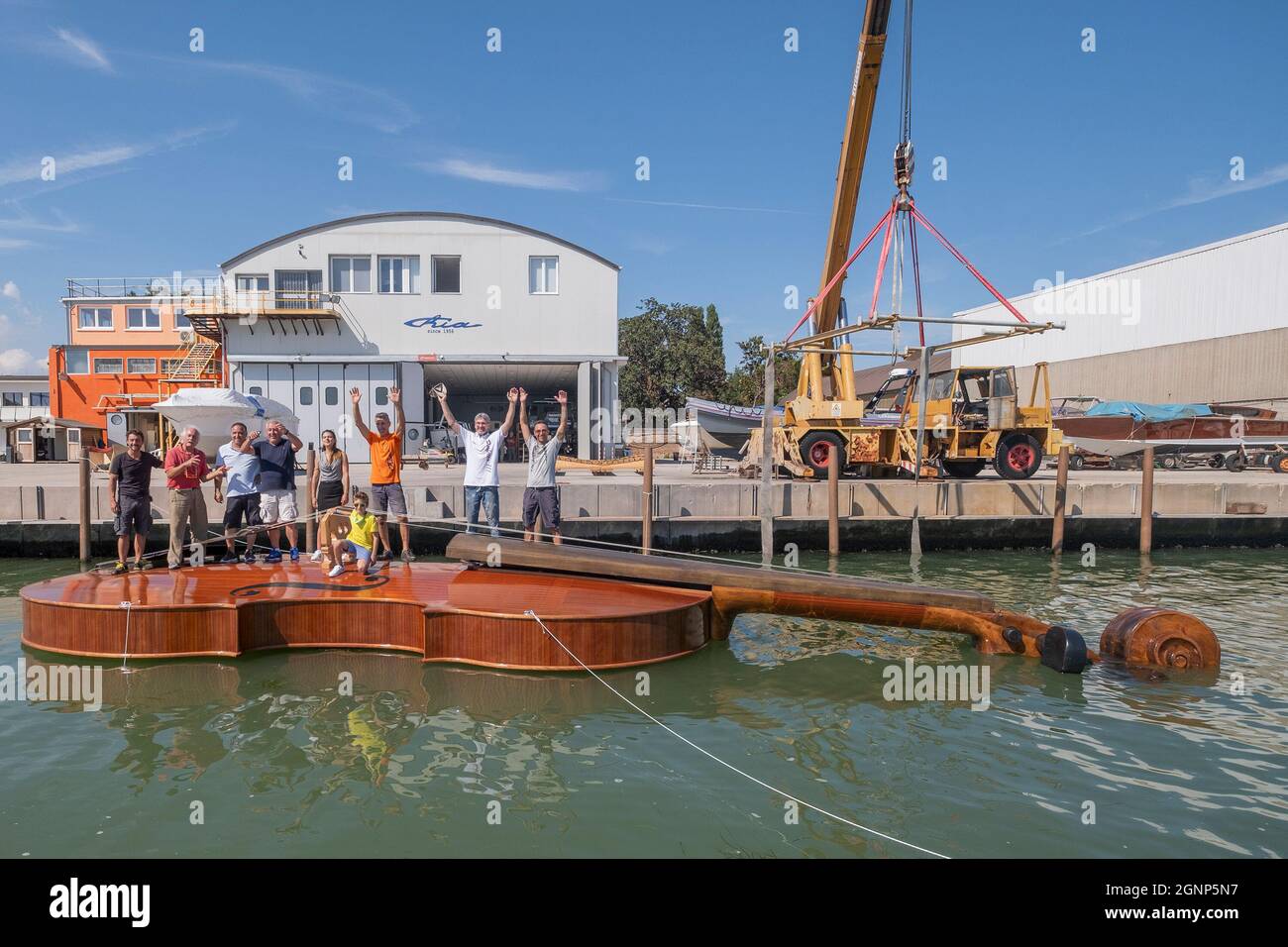 The launching of the violin-shaped boat Stock Photo - Alamy