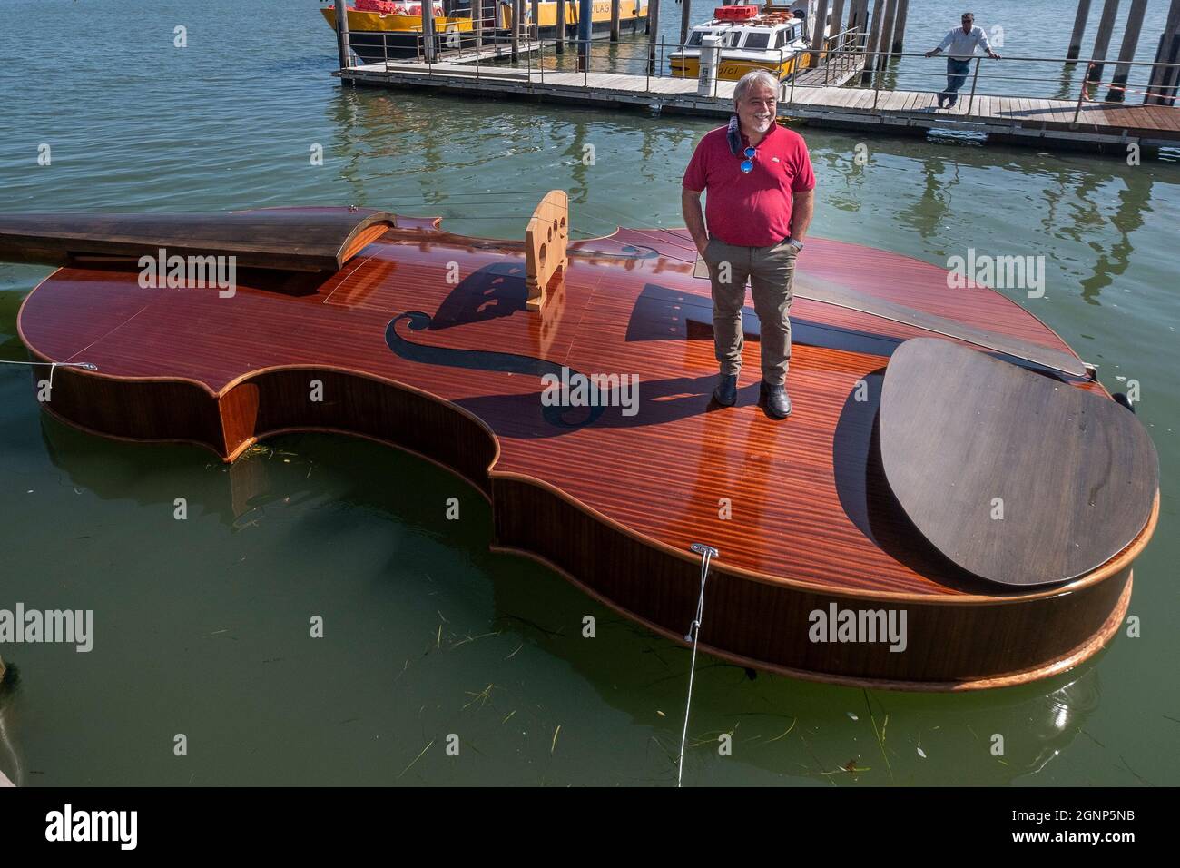 The launching of the violin-shaped boat Stock Photo - Alamy