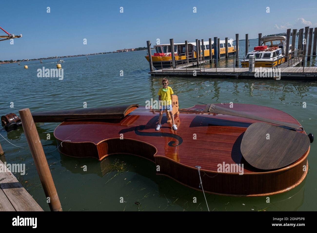 The launching of the violin-shaped boat Stock Photo - Alamy
