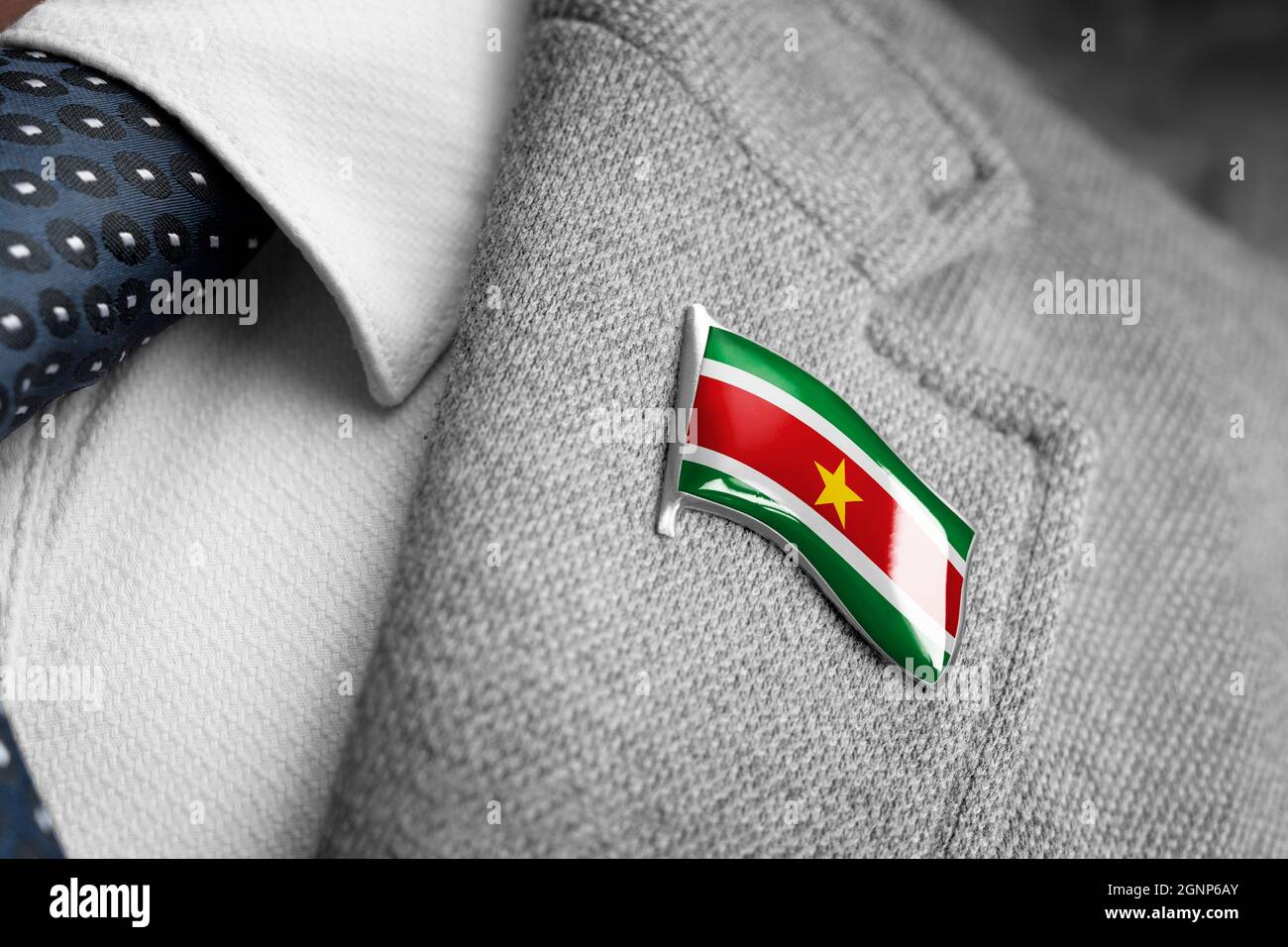 Metal badge with the flag of Suriname on a suit lapel Stock Photo - Alamy