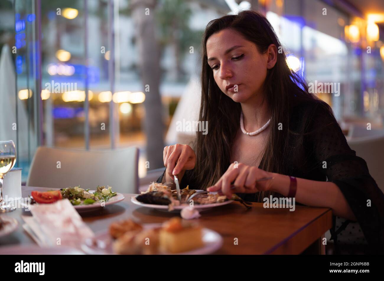 Young man eating in fancy restaurant hi-res stock photography and ...