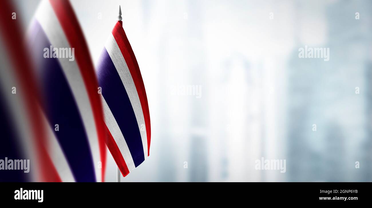 Small flags of Thailand on a blurry background of the city Stock Photo ...