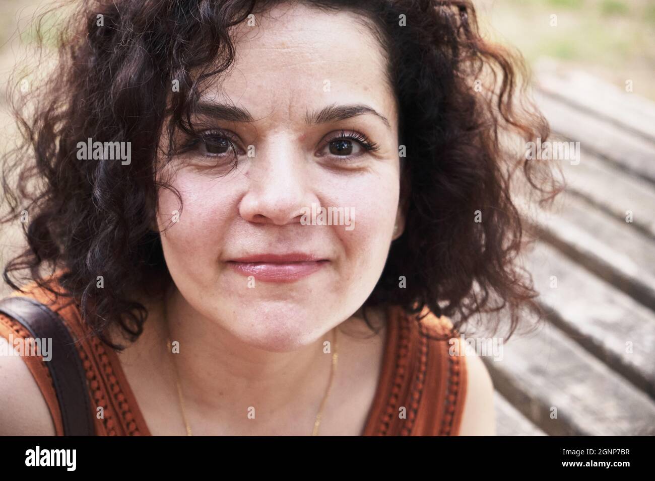 Closeup of a Hispanic woman's face with brown eyes and curly hair Stock ...