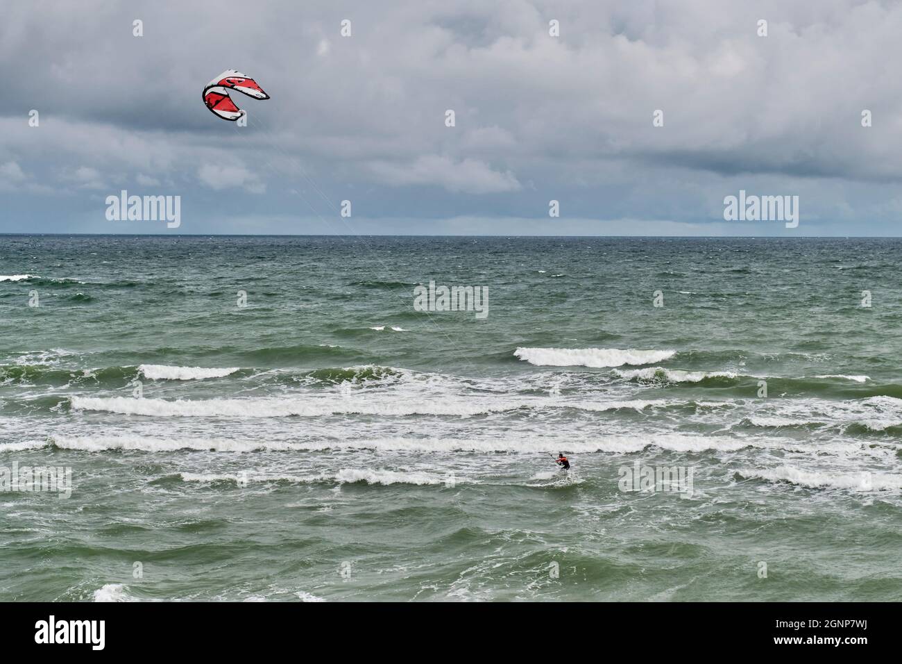 Kitesurfer is riding the waves hi-res stock photography and images - Alamy