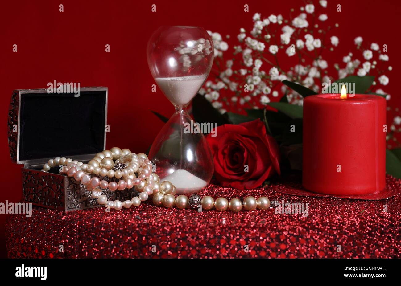Red Candle and Rose on Red Velvet Background Stock Photo - Alamy