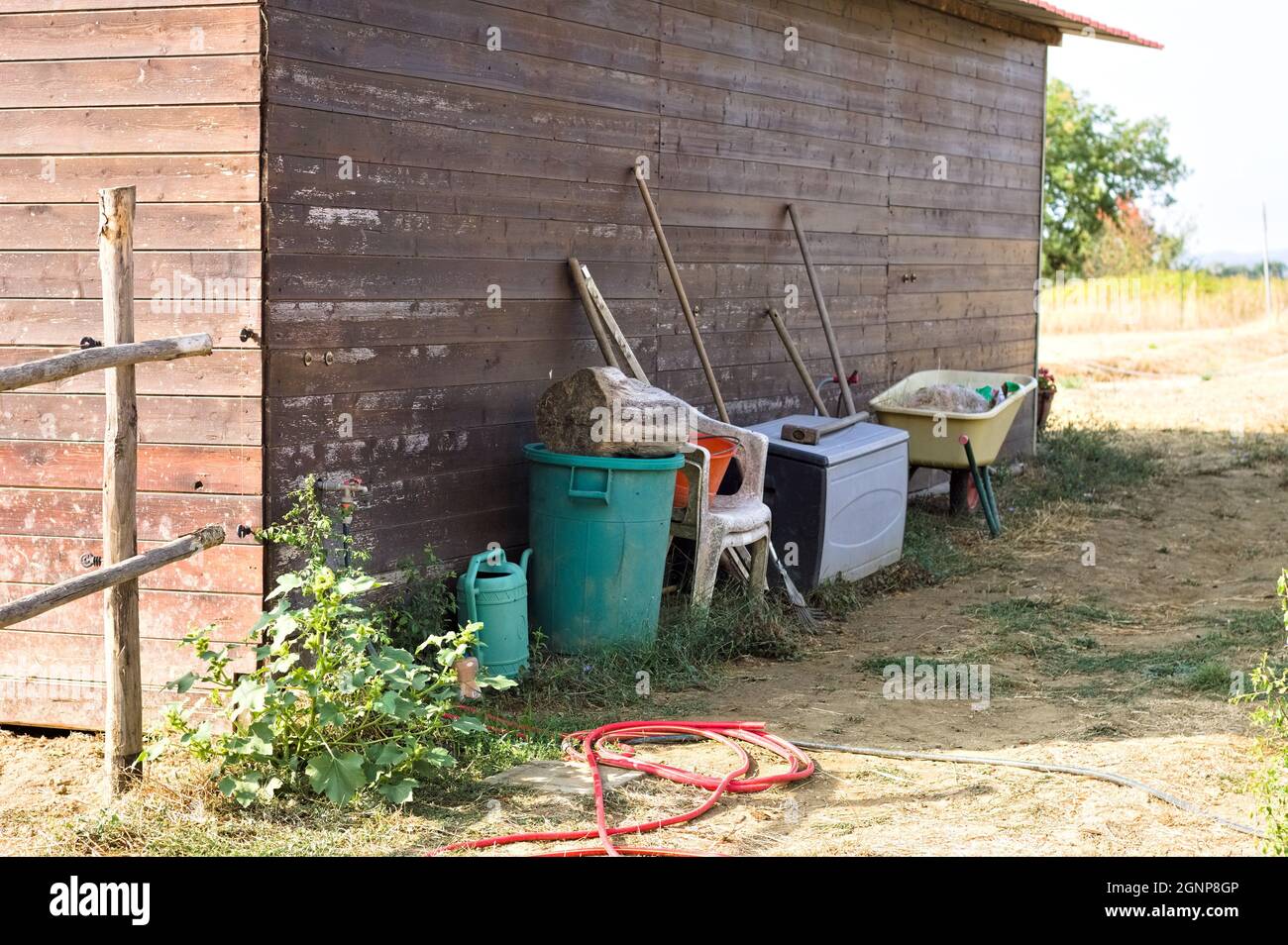 Farm tools stacked behind the barn (Umbria, Italy, Europe Stock Photo ...