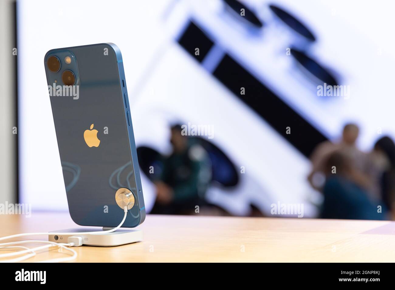 An iPhone 13 smartphone seen displayed inside an Apple Store in ...