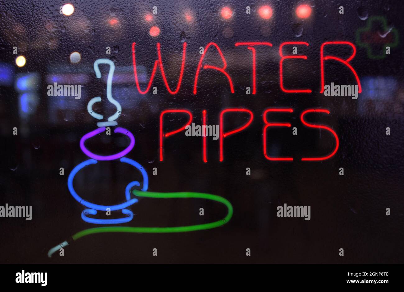 Vintage Neon Water Pipe Sign in Rainy Window Stock Photo - Alamy