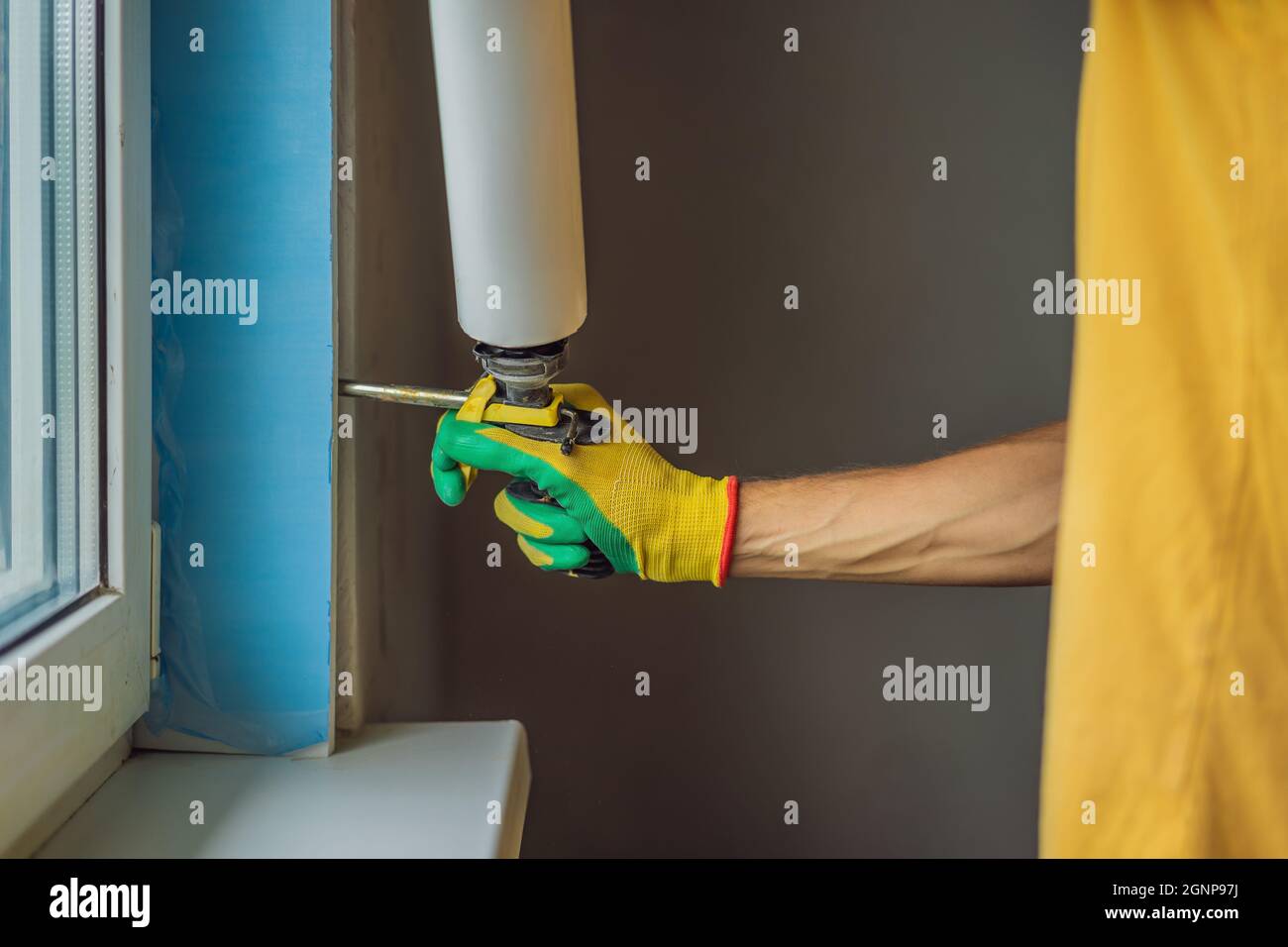 Builder or handyman is engaged in the repair or installation of windows ...