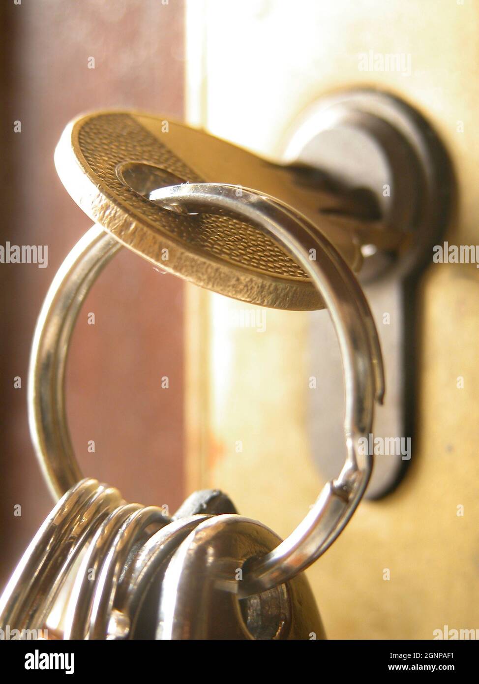 key in a keyhole Stock Photo - Alamy