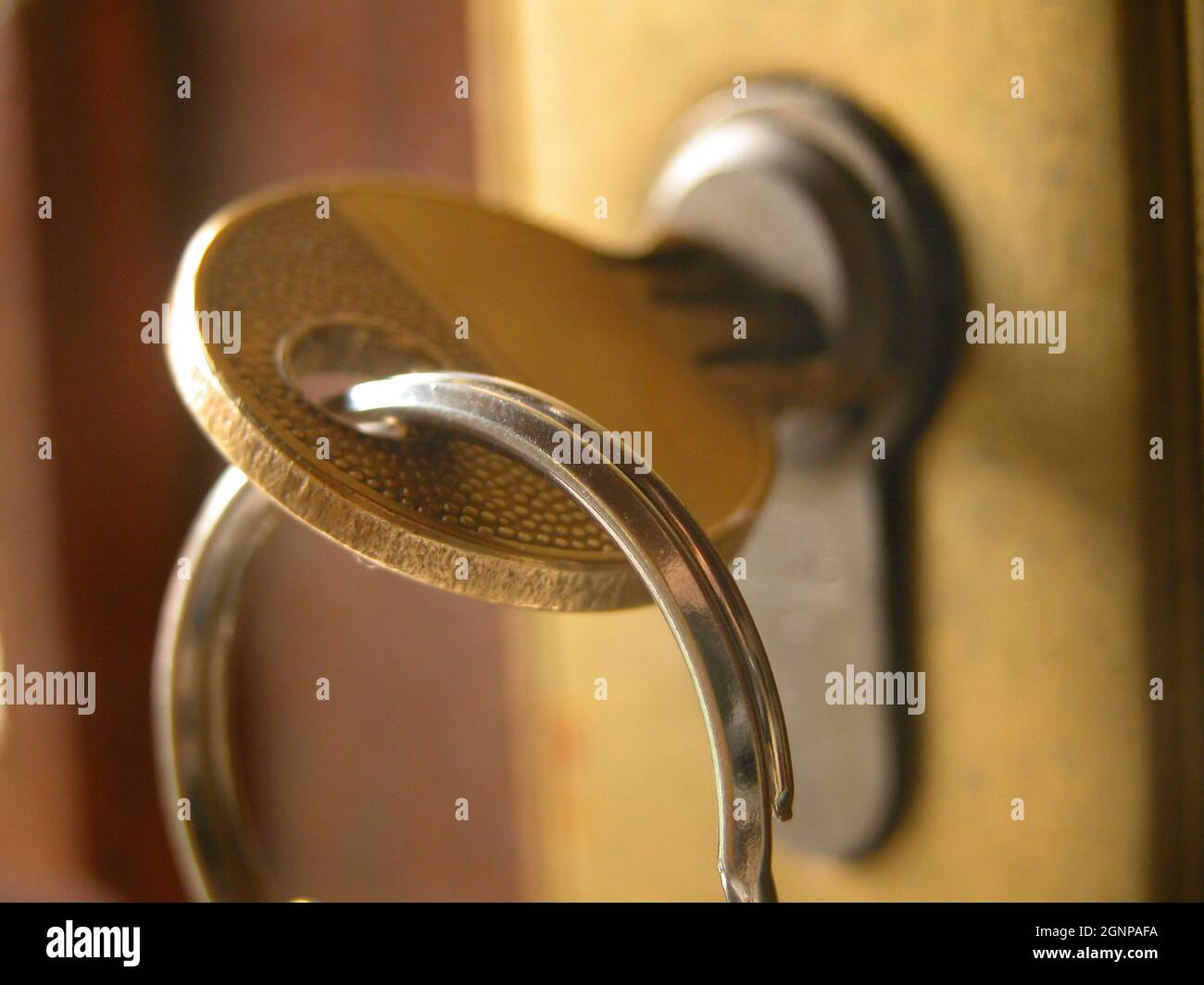 key in a keyhole Stock Photo - Alamy
