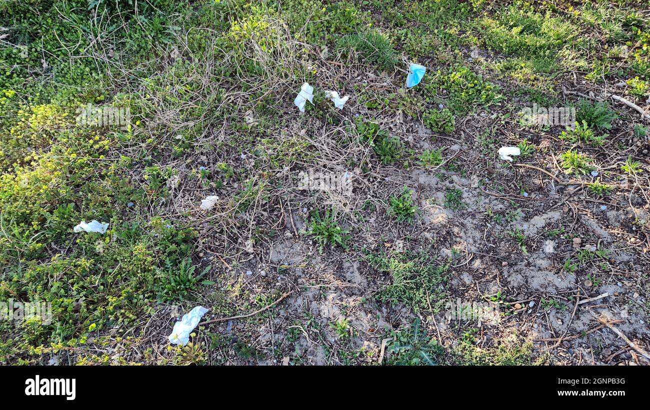 trashed face mask an other trash in the dunes, Netherlands Stock Photo ...