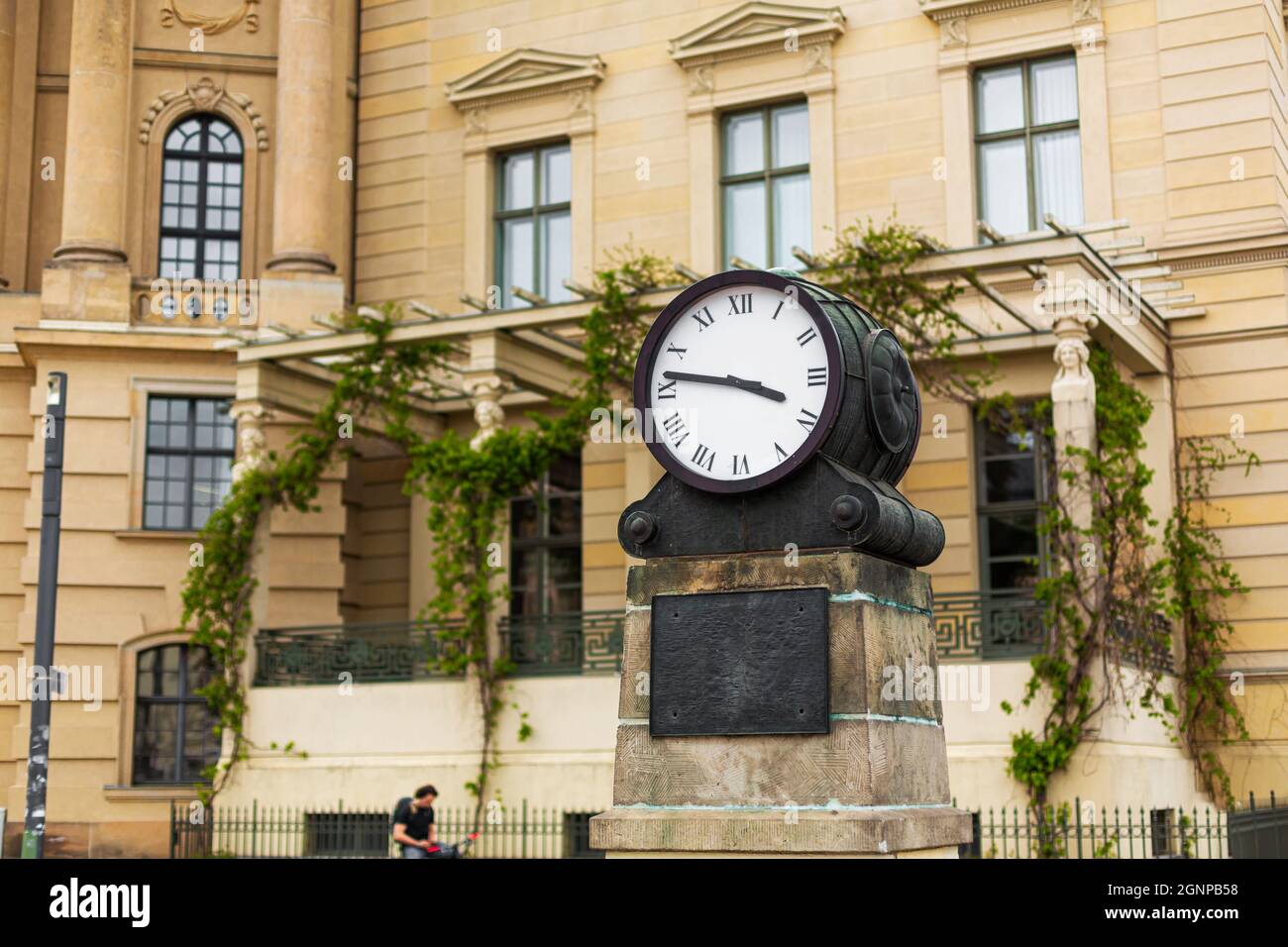 Large analog clock on a city street. City exterior Stock Photo - Alamy