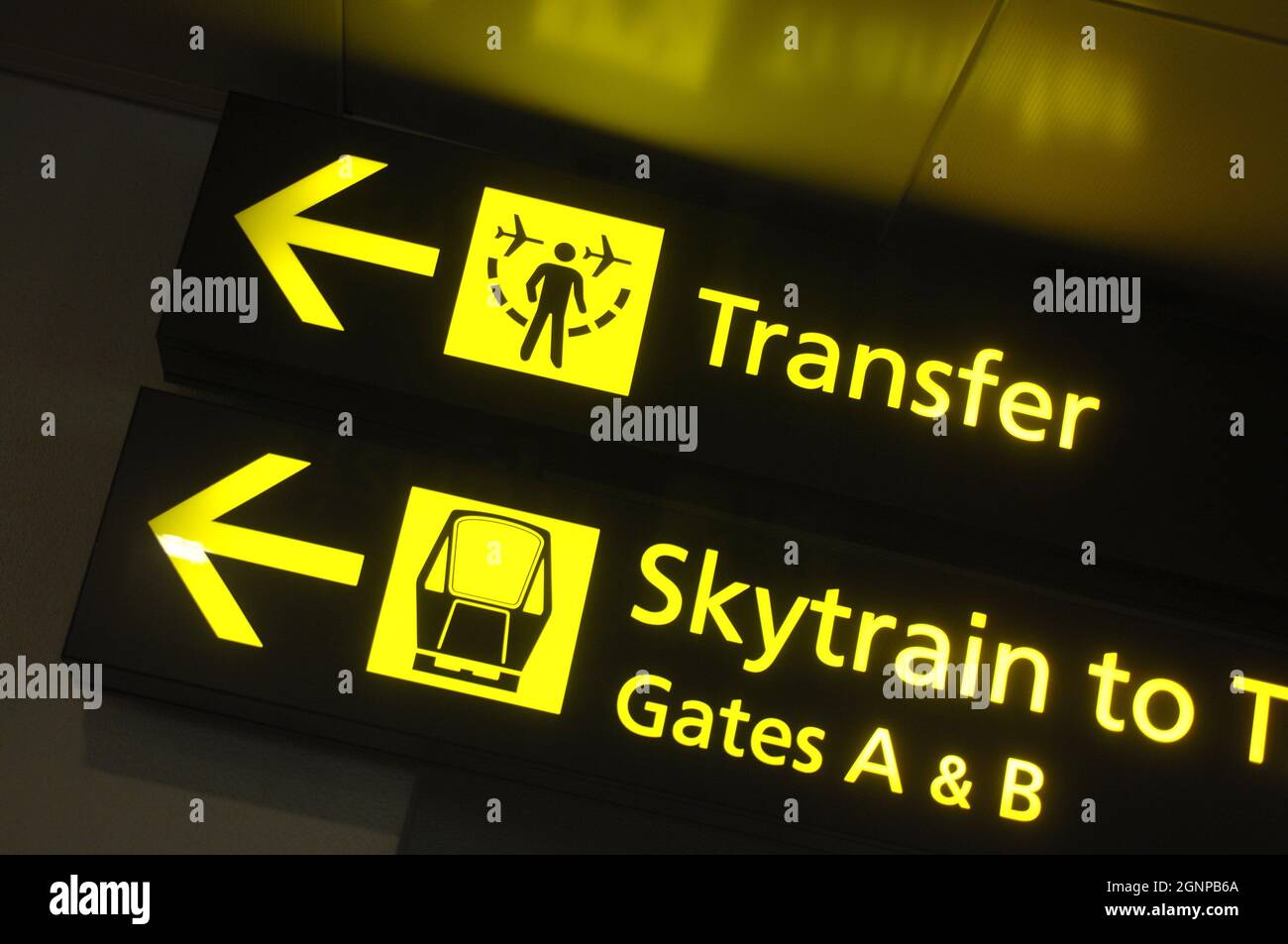 Direction signs in an airport, Singapore Stock Photo - Alamy