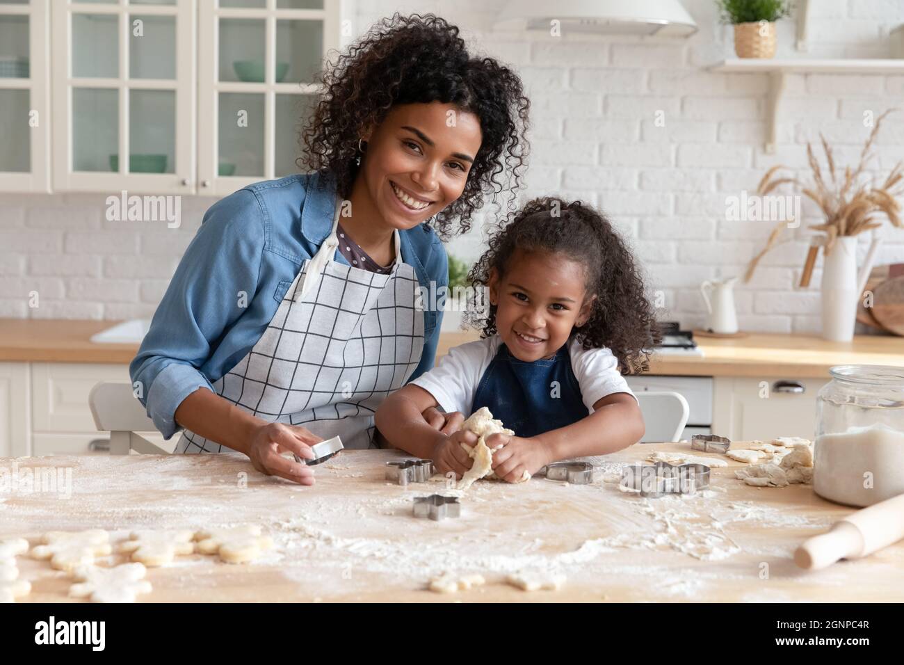 Head shot portrait smiling African American mother with daughter ...