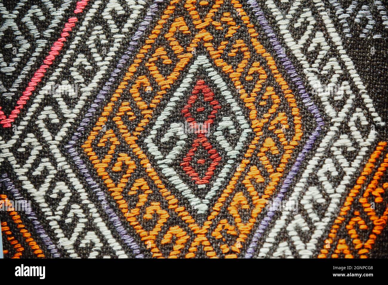 Beautiful handmade Turkish carpets and bedspreads, textiles in a shop ...