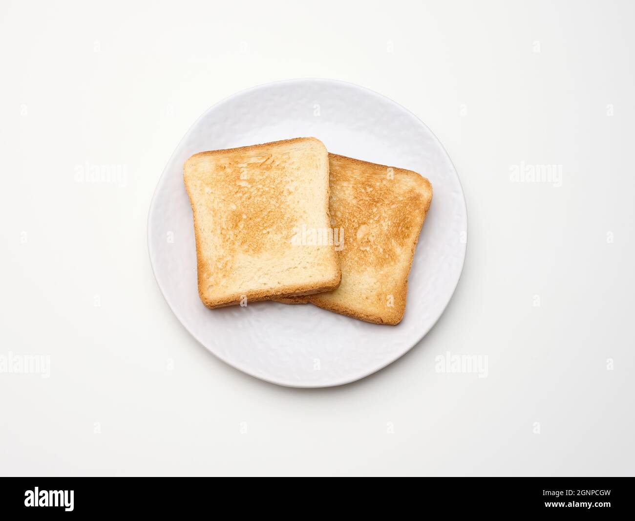 square pieces of toasted bread made from white wheat flour on a round ...