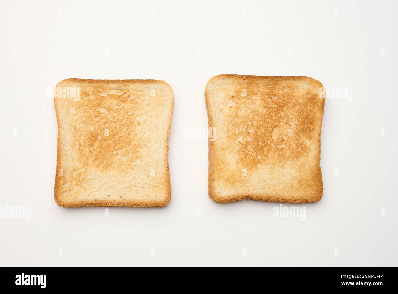 square slices of bread made from white wheat flour toasted in toaster ...