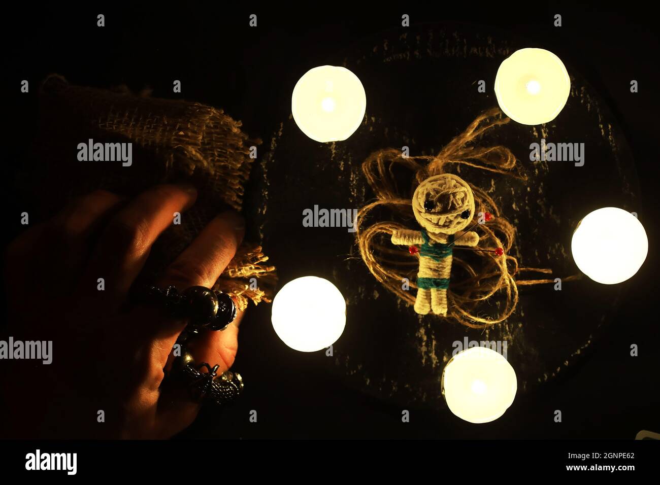 Mystic still life with voodoo doll, the tarot cards, books, evil ...